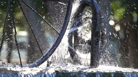 Beautiful fountain and spinning bicycle ... | Stock Video | Pond5