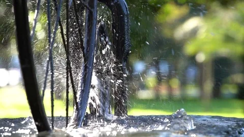 Beautiful fountain and spinning bicycle ... | Stock Video | Pond5