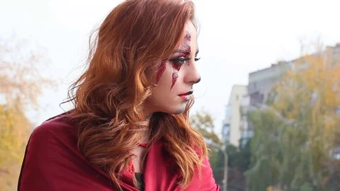 Beautiful girl with bleeding wound and r... | Stock Video | Pond5