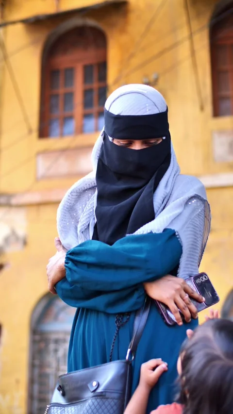 beautiful girl in a burqa on the street ... | Stock Video | Pond5
