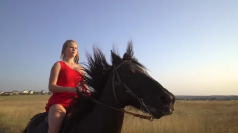 Beautiful girl horseback rider in red dr... | Stock Video | Pond5