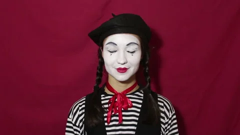 Beautiful girl mime makes a gesture of... | Stock Video | Pond5