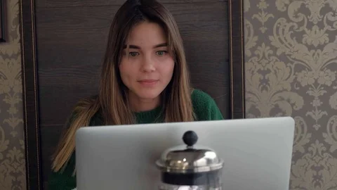 Beautiful girl model sitting at a table ... | Stock Video | Pond5