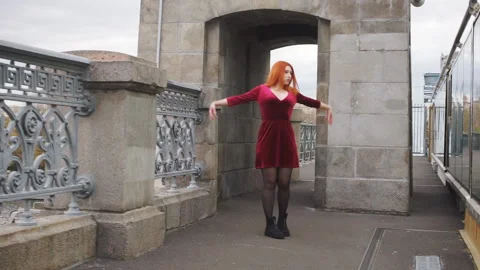 Beautiful girl with red hair is dancing ... | Stock Video | Pond5