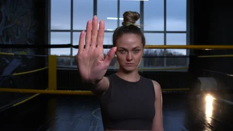 beautiful girl with a stern look shows a... | Stock Video | Pond5