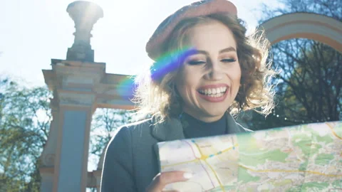 Beautiful girl - tourist with a map in t... | Stock Video | Pond5