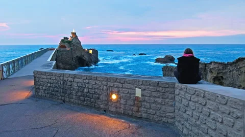 Beautiful girl watching the blue hour su... | Stock Video | Pond5