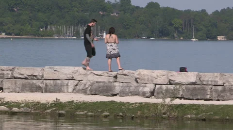 Beautiful hot summer day by the lake wit... | Stock Video | Pond5
