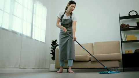 Beautiful housewife mopping with mop and... | Stock Video | Pond5