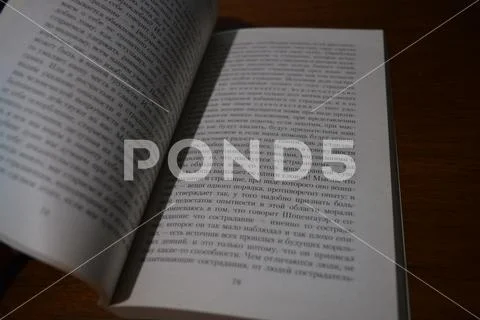 Beautiful, interesting books are arranged on lacquered wooden ...