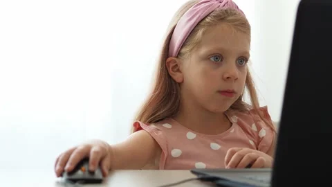 A beautiful little girl stares intently ... | Stock Video | Pond5