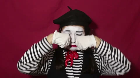 Beautiful mime girl depicts a strong ups... | Stock Video | Pond5