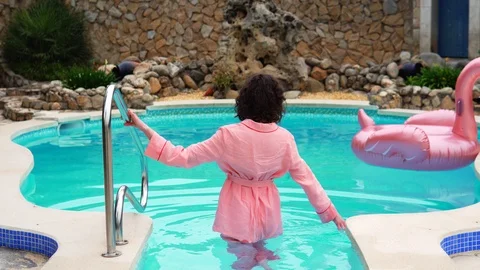 Beautiful model poses waist-deep in the ... | Stock Video | Pond5