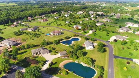 Beautiful neighborhoods, homes, ponds, a... | Stock Video | Pond5
