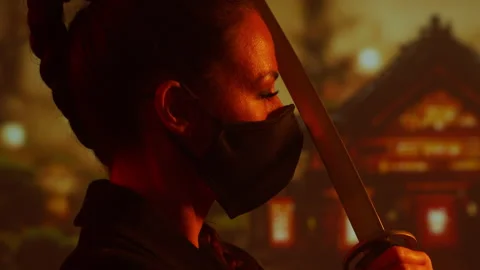 Beautiful ninja girl in a mask and with ... | Stock Video | Pond5