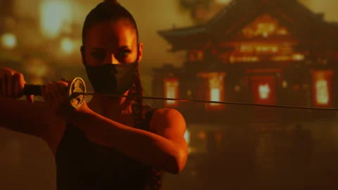 Beautiful ninja girl in a mask and with ... | Stock Video | Pond5