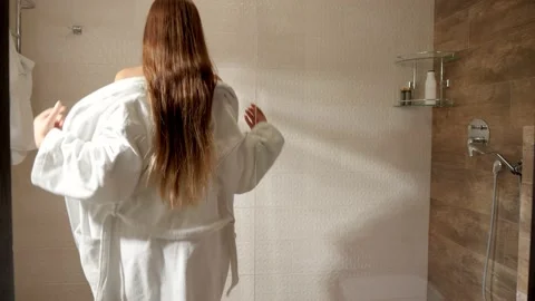 Beautiful sexy woman taking off bathrobe... | Stock Video | Pond5
