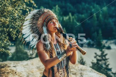 Beautiful shamanic girl playing on shaman flute in the nature. ~ Hi Res ...