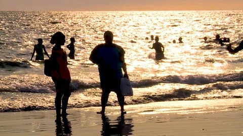 beautiful sunset in backlight on a beach... | Stock Video | Pond5
