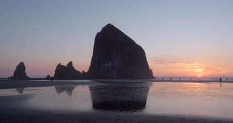 Beautiful sunset at Haystack rock, Canno... | Stock Video | Pond5