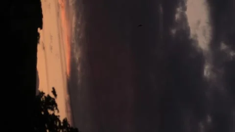 beautiful sunset, red-blue clouds over t... | Stock Video | Pond5