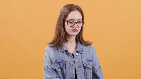 Beautiful teenage girl nods her head in ... | Stock Video | Pond5