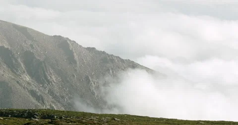 Beautiful thick clouds moving by the mou... | Stock Video | Pond5
