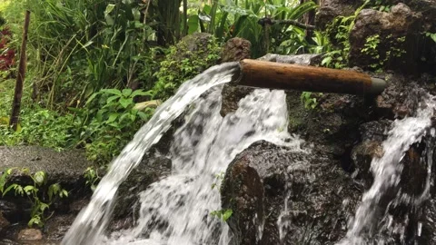 Beautiful waterfall drop from traditiona... | Stock Video | Pond5