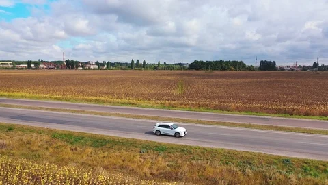 Beautiful white car moving on the road. ... | Stock Video | Pond5