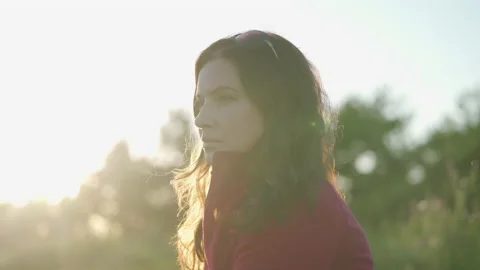beautiful woman face at sunset nature su... | Stock Video | Pond5