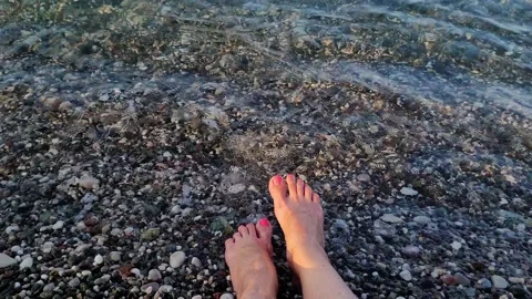Beautiful woman legs in the blue sea wit... | Stock Video | Pond5