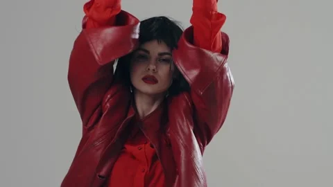A beautiful woman model poses in a red c... | Stock Video | Pond5