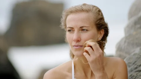 Beautiful woman poses for the camera on ... | Stock Video | Pond5