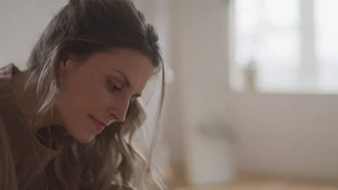 A Beautiful Woman Sitting Quietly on Her... | Stock Video | Pond5