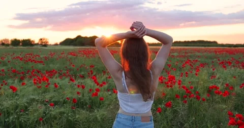 Beautiful young girl walking in flower p... | Stock Video | Pond5