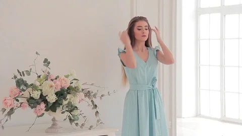 Beautiful young model in light blue dres... | Stock Video | Pond5