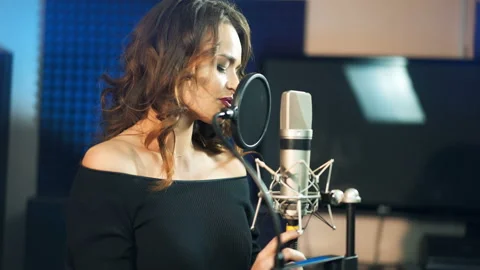 Beautiful young singer who recorded a so... | Stock Video | Pond5