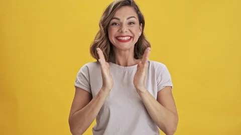 Beautiful young woman clapping her hands... | Stock Video | Pond5