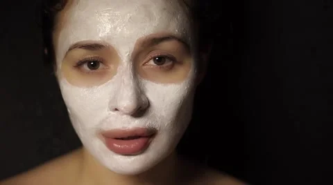 Beautiful young woman with a face pack o... | Stock Video | Pond5