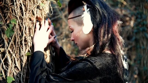 Beautyful Viking woman conjures a tree a... | Stock Video | Pond5