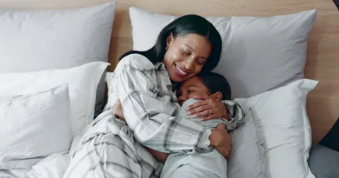 Bed, hug and mother with child with pare... | Stock Video | Pond5