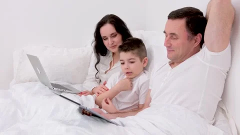 bed linen advertising family watching mo... | Stock Video | Pond5
