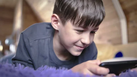 Bedtime Fun: Playful Boy Lying on Bed an... | Stock Video | Pond5