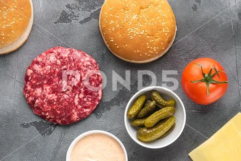 Beef burger ingredients, on gray stone background, top view flat lay ...