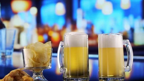 Beer in a beer glass, forming effervesce... | Stock Video | Pond5