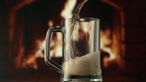 beer on a fire background in a dark. fl... | Stock Video | Pond5
