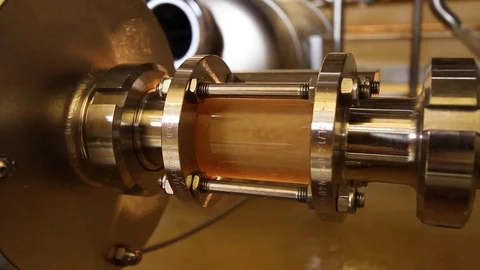 Beer flowing through the Sight Glass of ... | Stock Video | Pond5