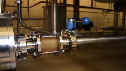 Beer flowing through the Sight Glass of ... | Stock Video | Pond5