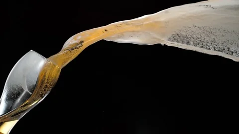 Beer spilled out of glass and making spl... | Stock Video | Pond5