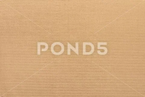 Photograph: Beige colored corduroy cloth fabric texture. #160867452